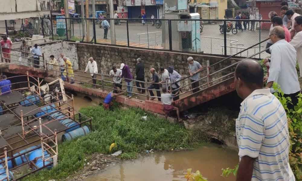 Residents clear choking of nala