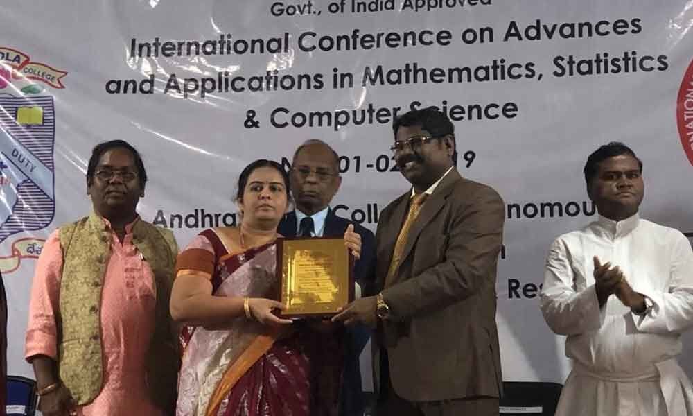 Best Scientist Award for SPMVV faculty