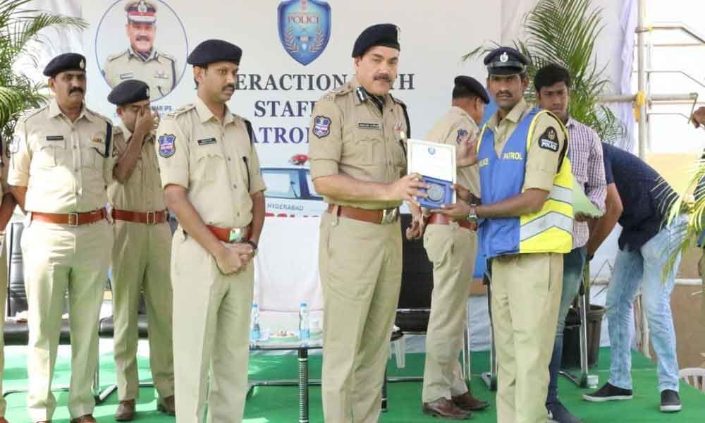 Police Commissioner Anjani Kumar pats patrolling staff