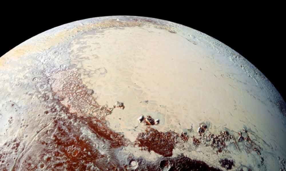 Pluto's icy heart rules its atmospheric circulation