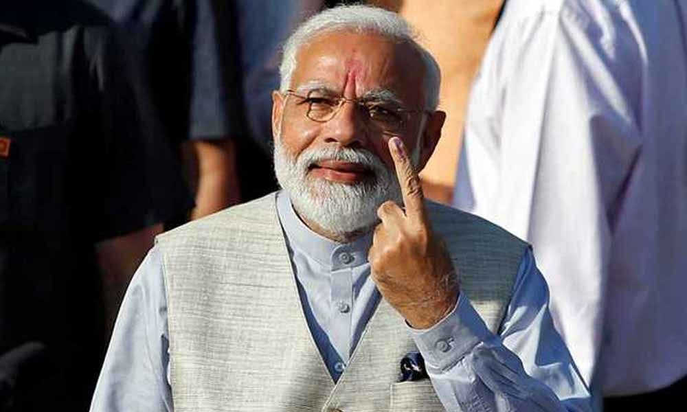 Modi, Shah urge Delhi voters to vote