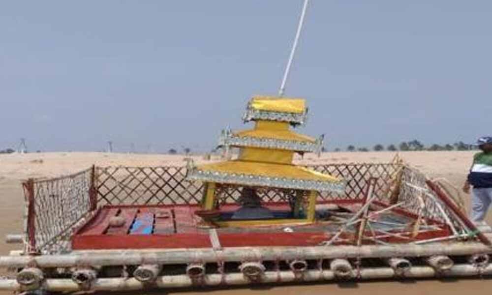 A Bamboo raft reaches seashore of Prakasam beach from Romania
