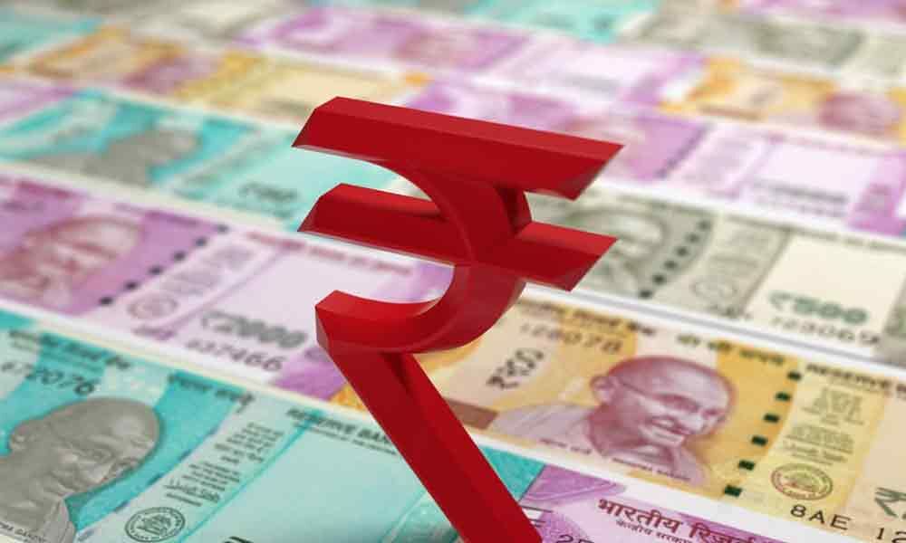 Falls to record low of 76.87 against dollor