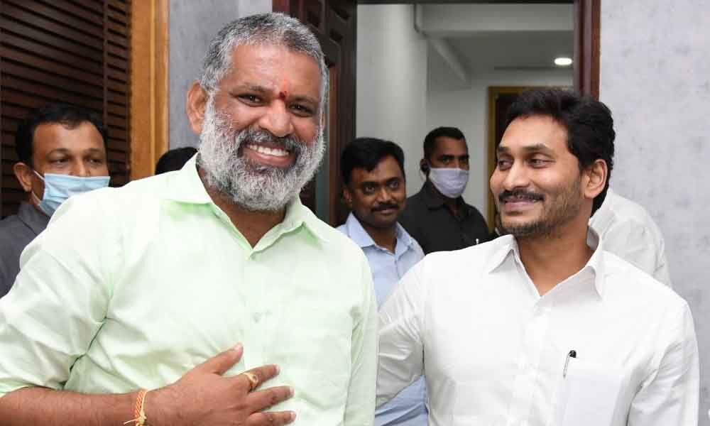 CM YS Jagan Mohan Reddy pats Chevireddy Bhaskar Reddy for record downloading of Disha app