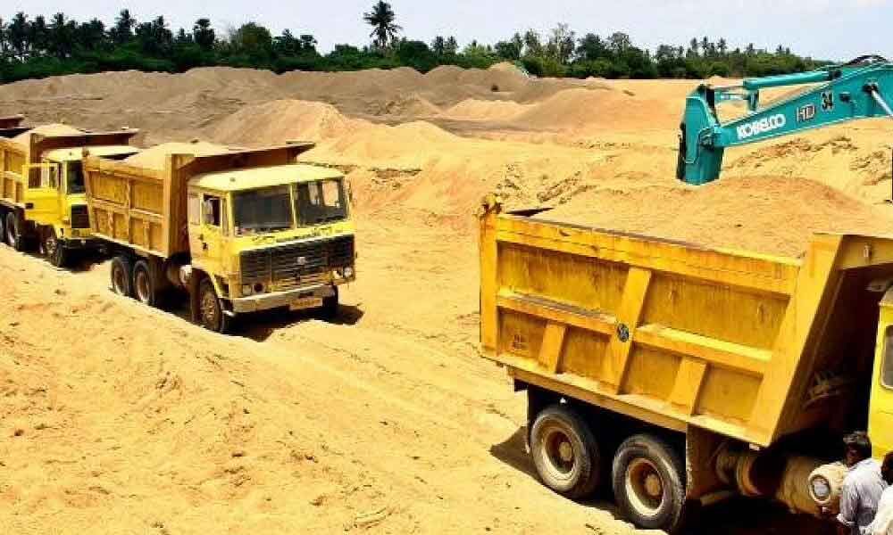 Vijayawada: Truck drivers struck in sand quarry