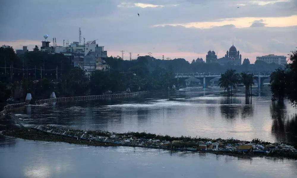 Musi River was flowing at its peak near Chaderghat Bridge