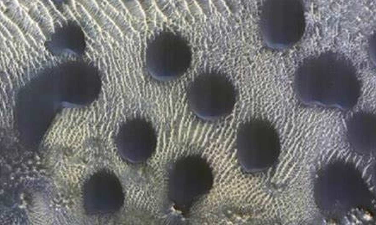 NASA spacecraft captures unusual circles of sand dunes on Mars