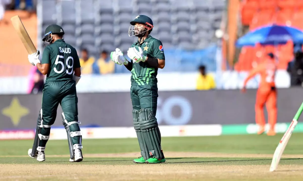 Pakistan's Saud Shakeel, left, is congratulated by teammate Mohammad ...
