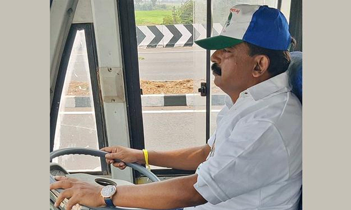 Perni Nani turns bus driver, takes cadre in bus to YS Jagan's Eluru Siddham meeting