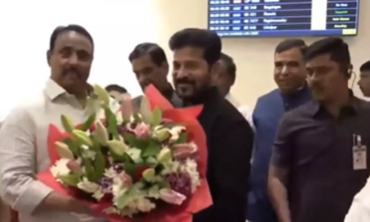 CM Revanth Returns from Davos Visit, Receives Grand Welcome in Hyderabad