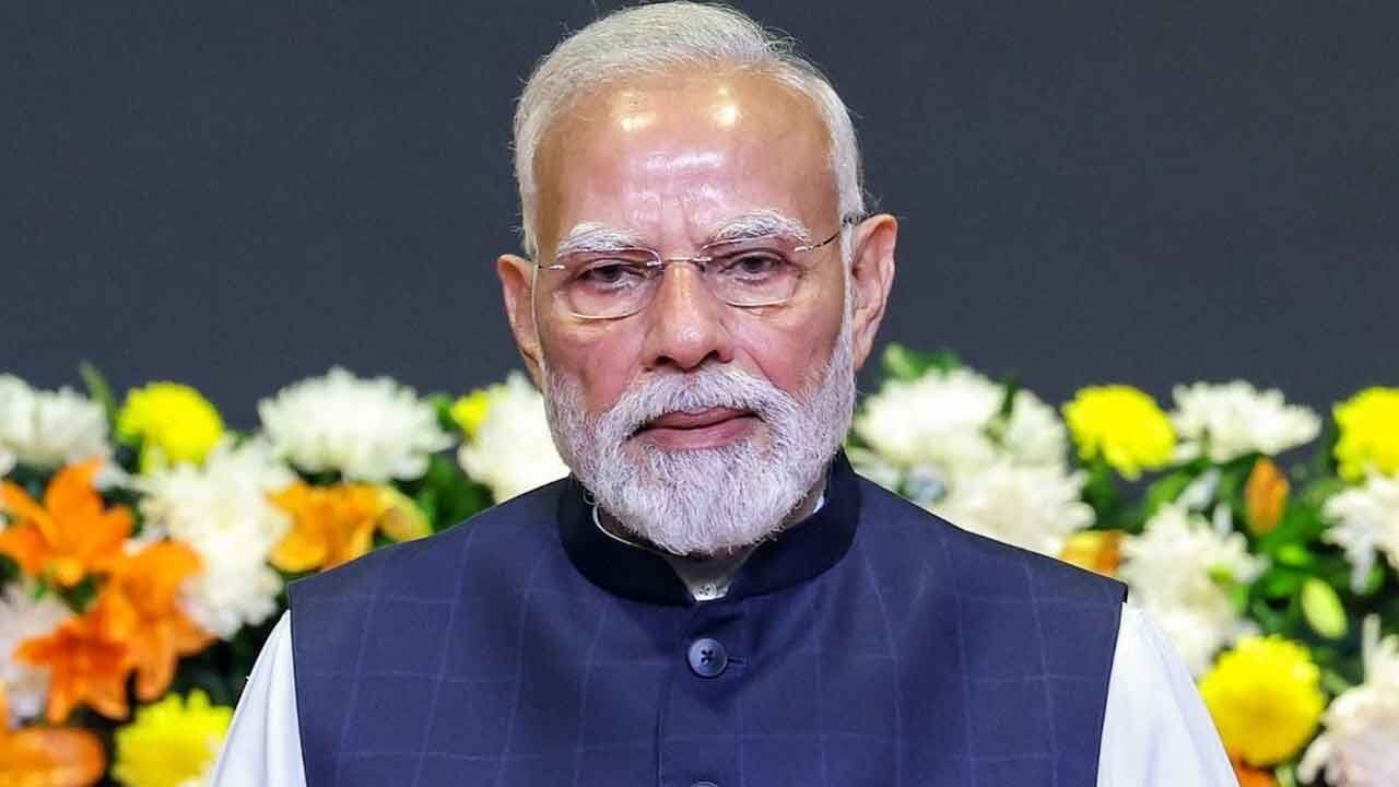 PM unveils Rs 100 coin, stamp at RSS centenary