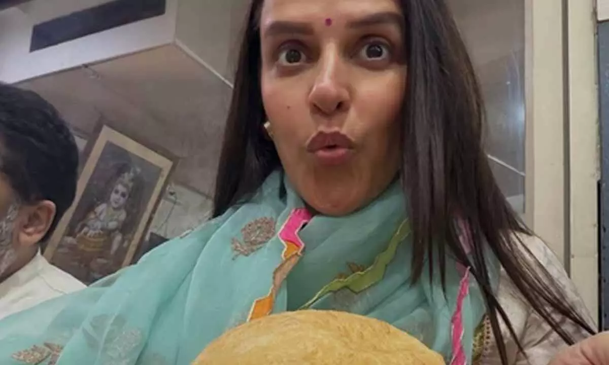Neha Dhupia dives into authentic chole bhature, seeks blessings at ...