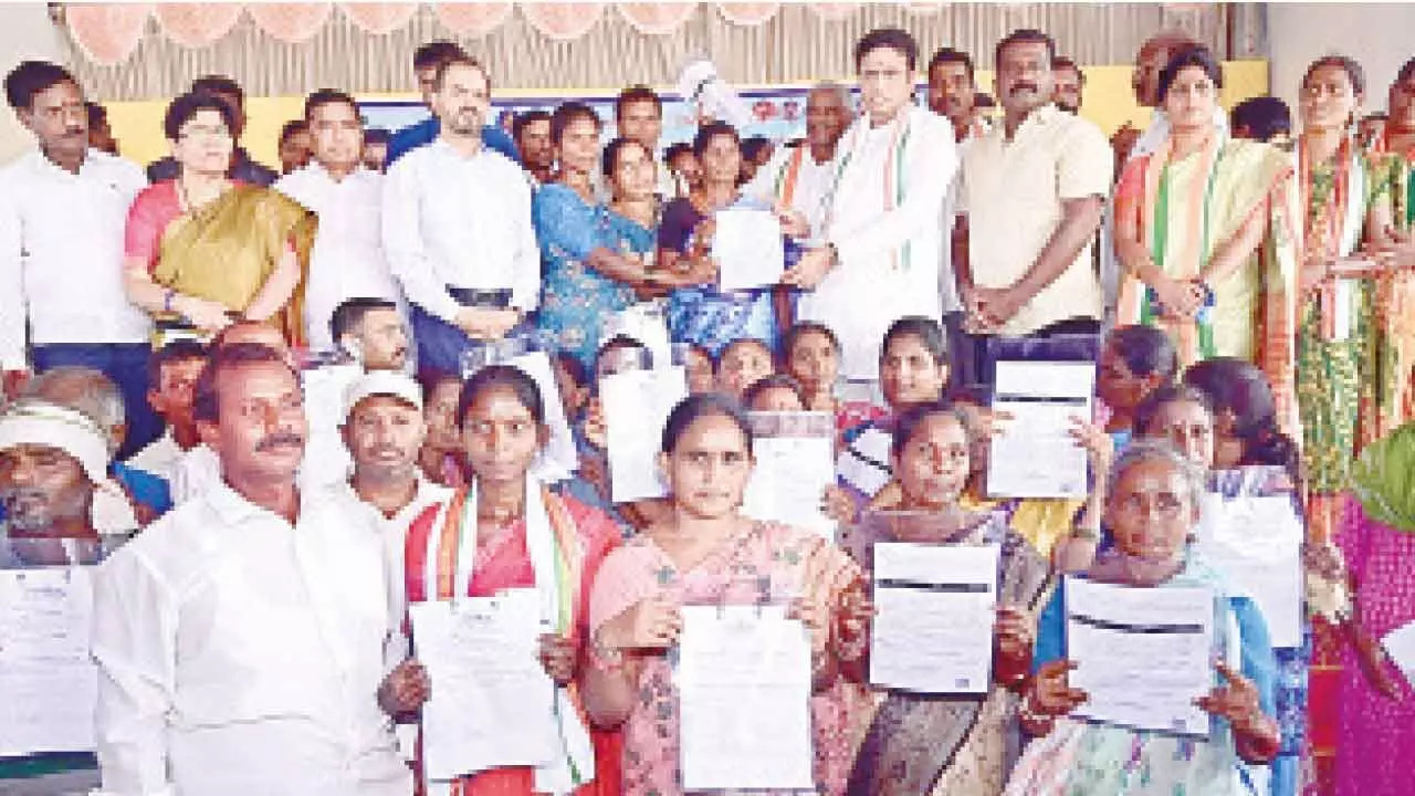 Minister hands over Indiramma house letters to second batch of ...