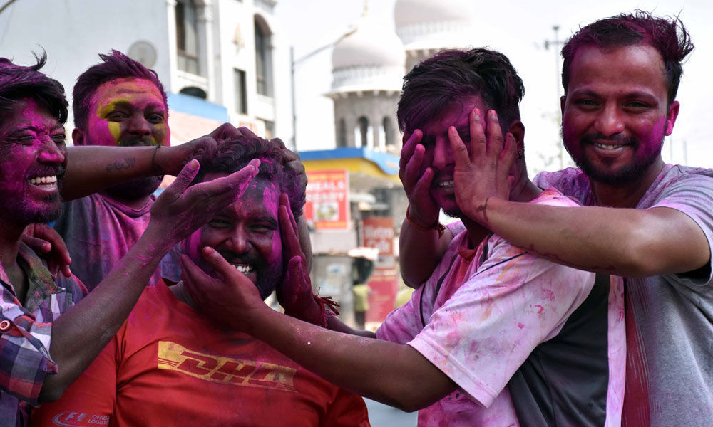 People celebrating Holi festival in the city